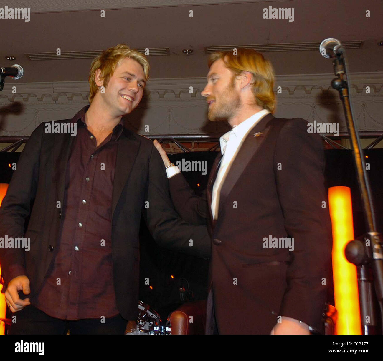 Brian McFadden and Ronan Keating performing at the Maire Keating ...