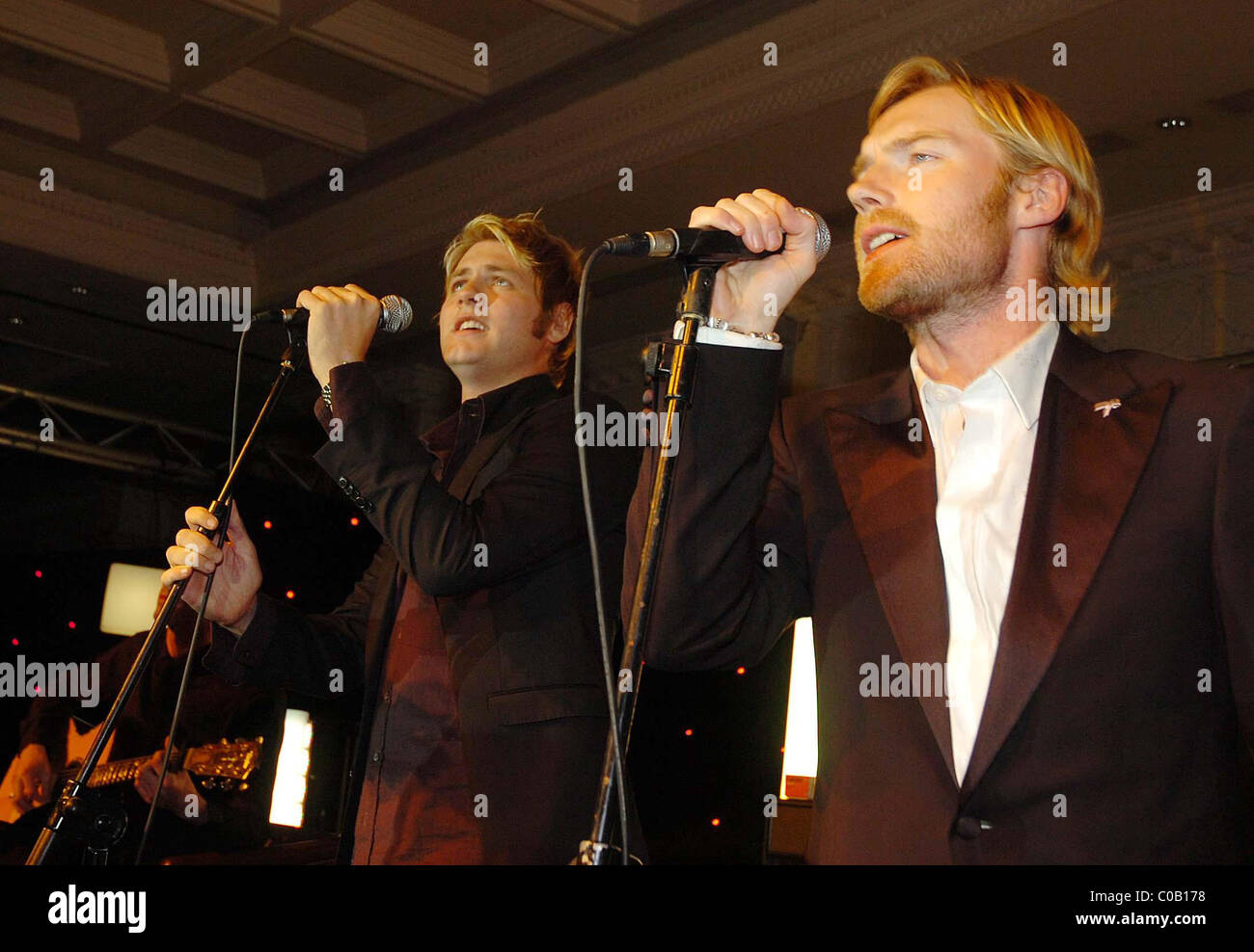 Brian McFadden and Ronan Keating performing at the Maire Keating ...