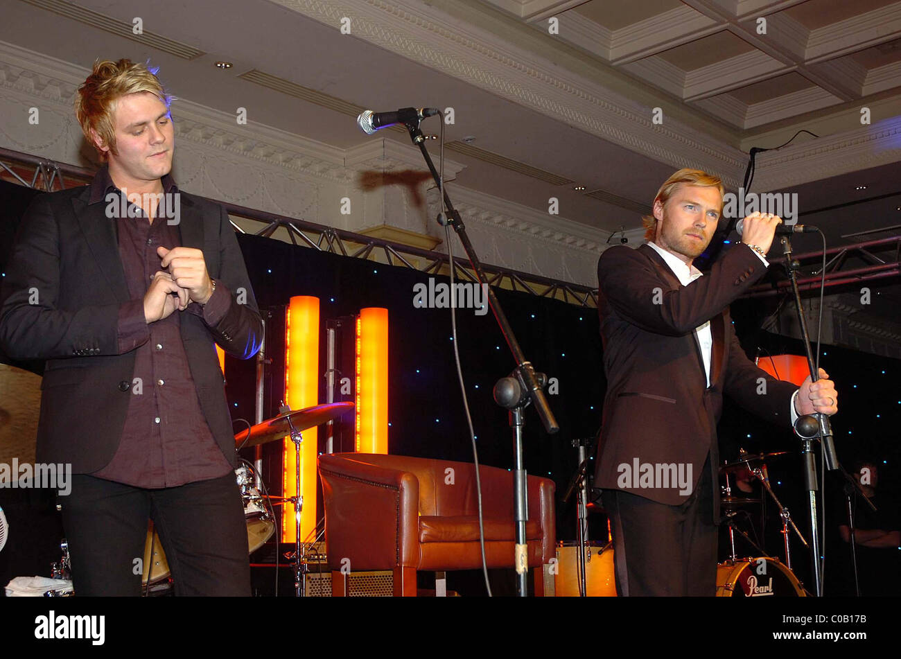Brian McFadden and Ronan Keating performing at the Maire Keating ...