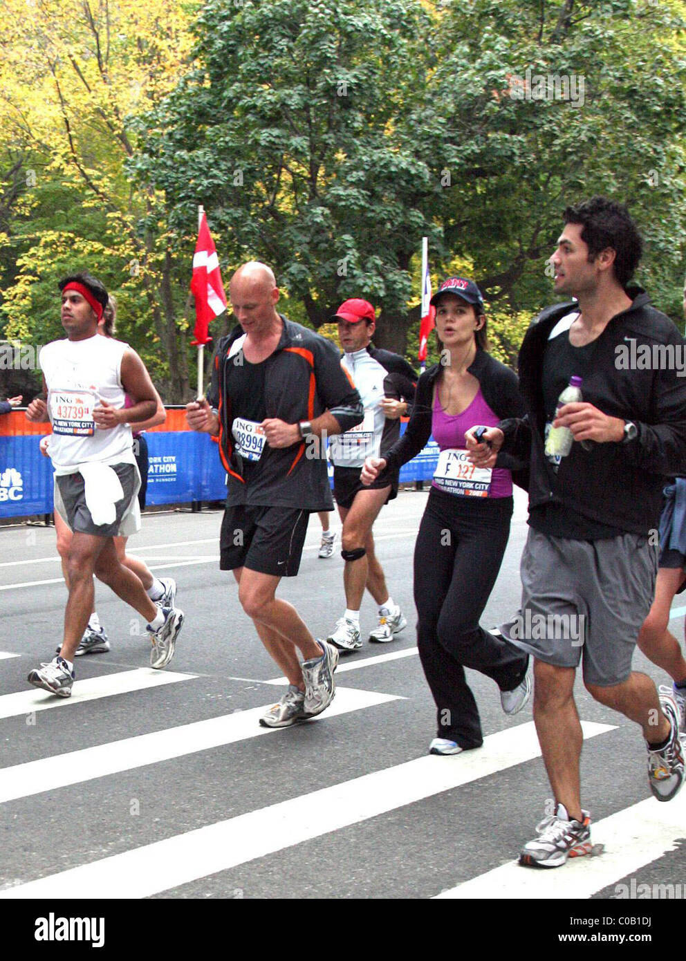 Katie Holmes running towards the finish line in her first NYC Marathon ...