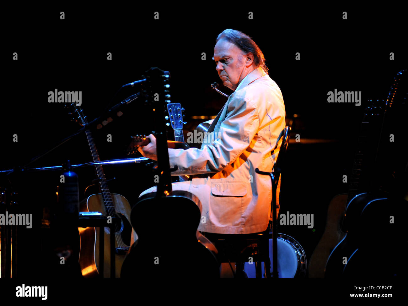Neil Young performing live in concert at the Hammersmith Apollo London ...
