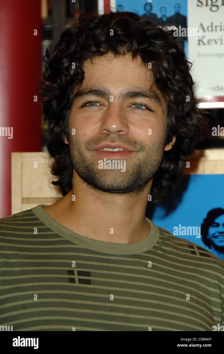 Adrian Grenier from the HBO series 'Entourage' signing copies of the ...