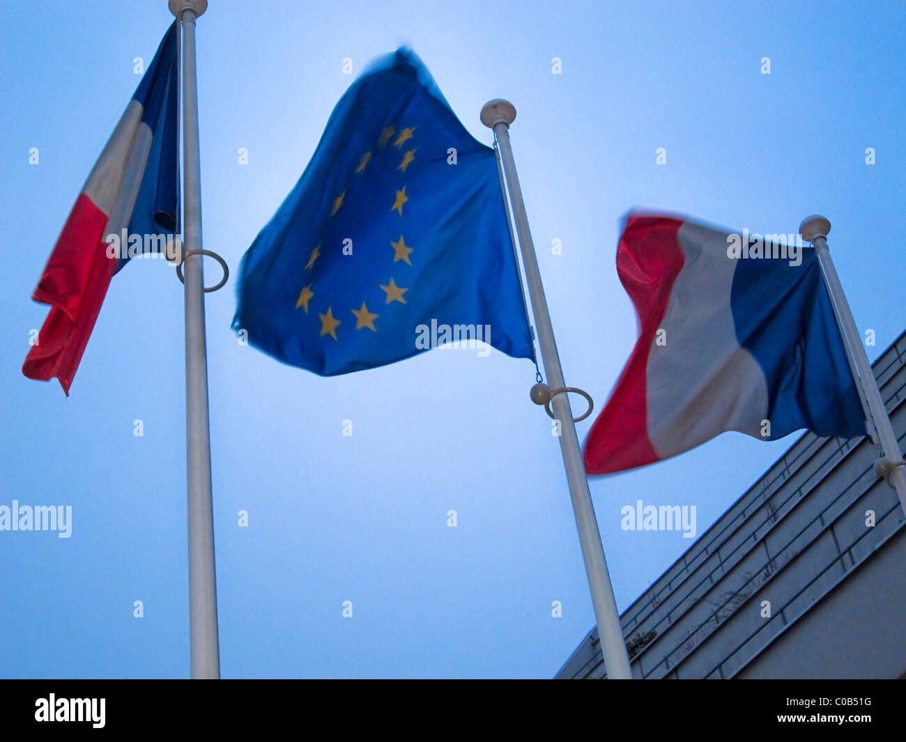 Paris, France, French and European Flags Flying Outside at Dusk Stock ...