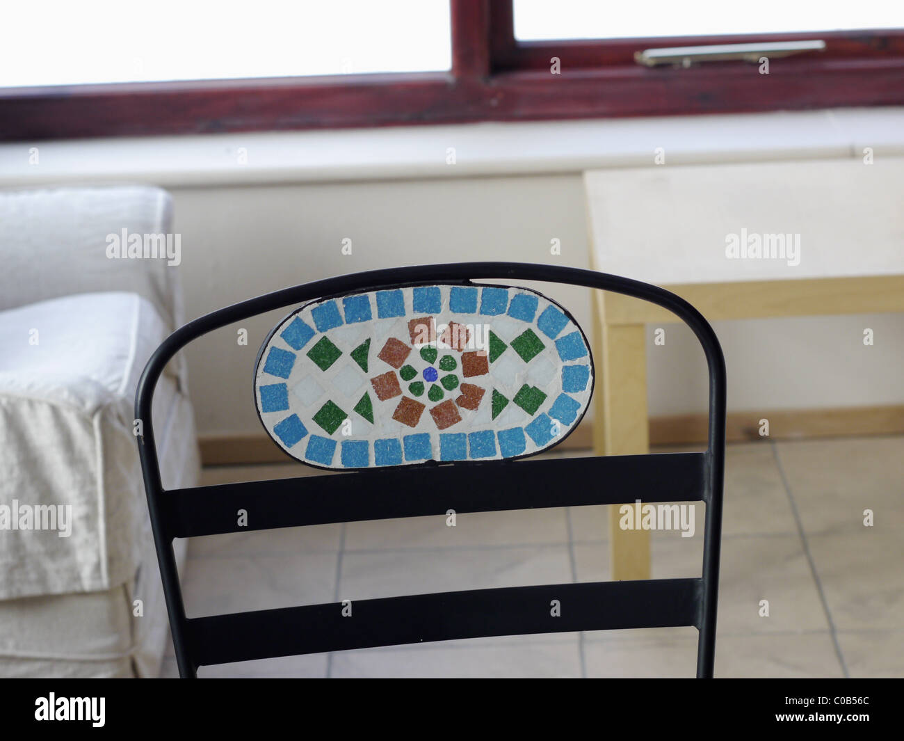 mosaic on conservatory chair Stock Photo - Alamy