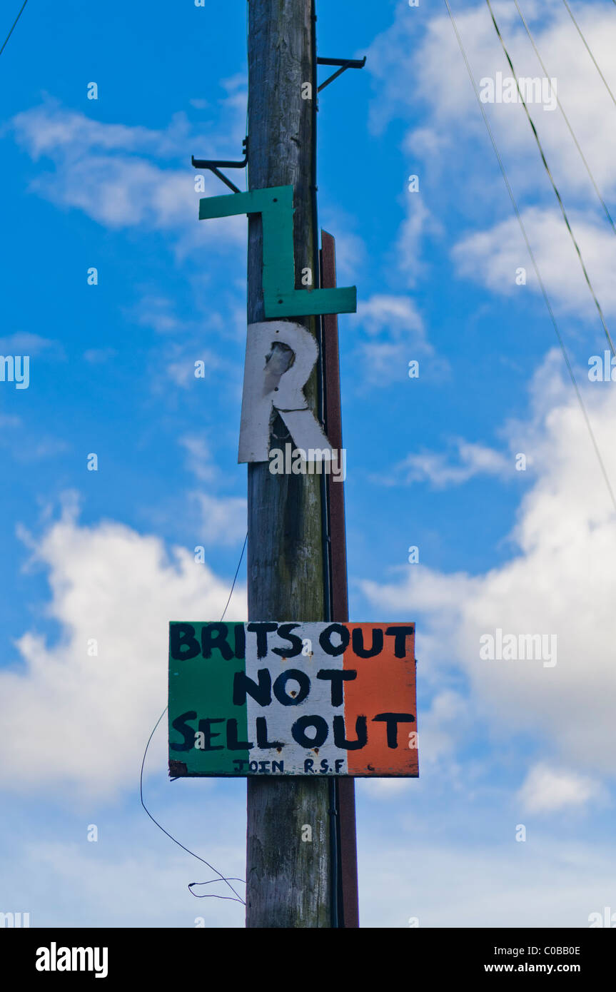 Old battered IRA sign on a lamppost in West Belfast. "Brits out, not ...