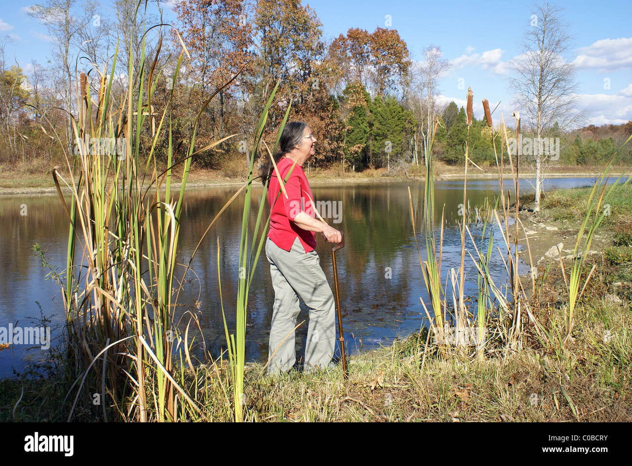 Woman hiking along lake hi-res stock photography and images - Alamy