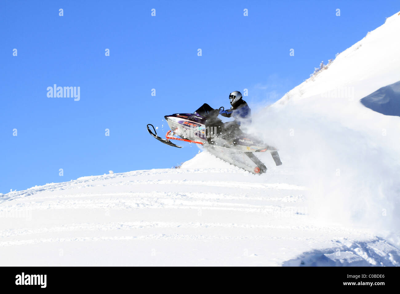 Snowmobile Jumping Extreme Snowmobiling High Resolution Stock ...