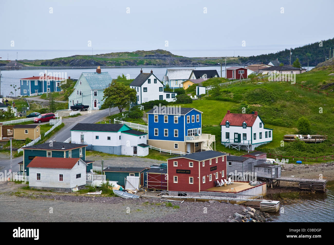 Colourful houses of a fishing village on the coast of Newfoundland ...