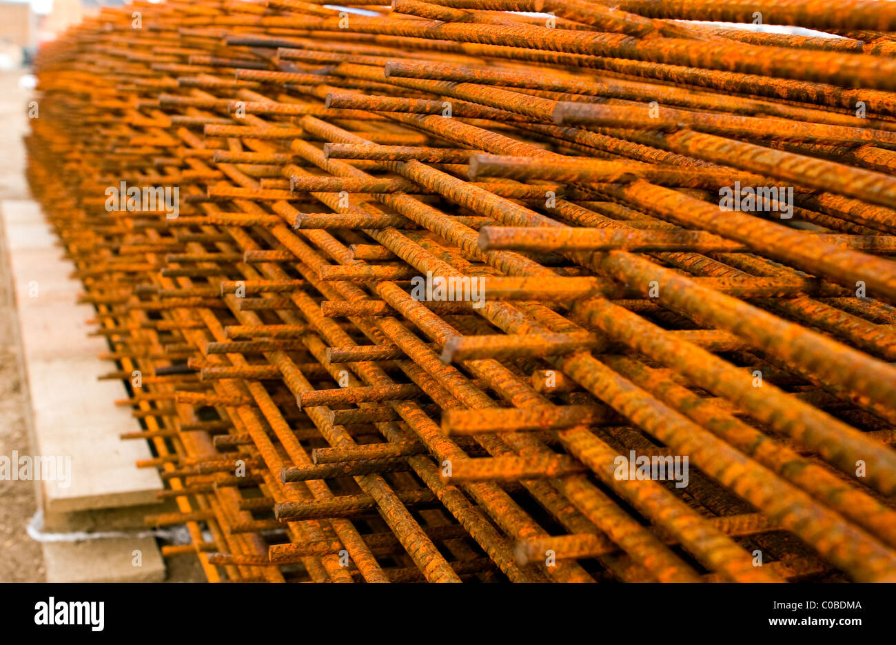 Rusting reinforcement bars for concrete on large building site in ...