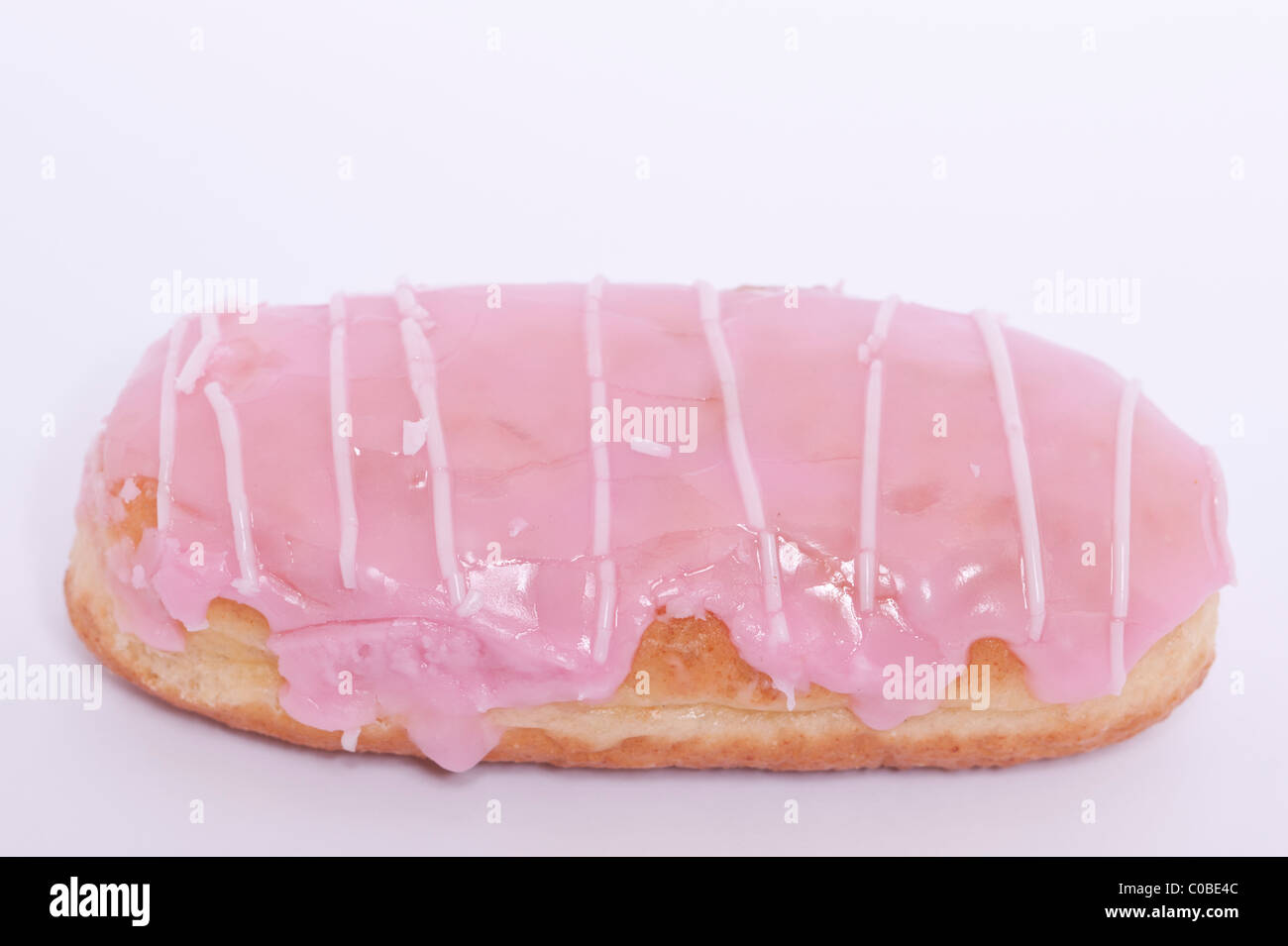 A pink iced donut on a white background Stock Photo - Alamy