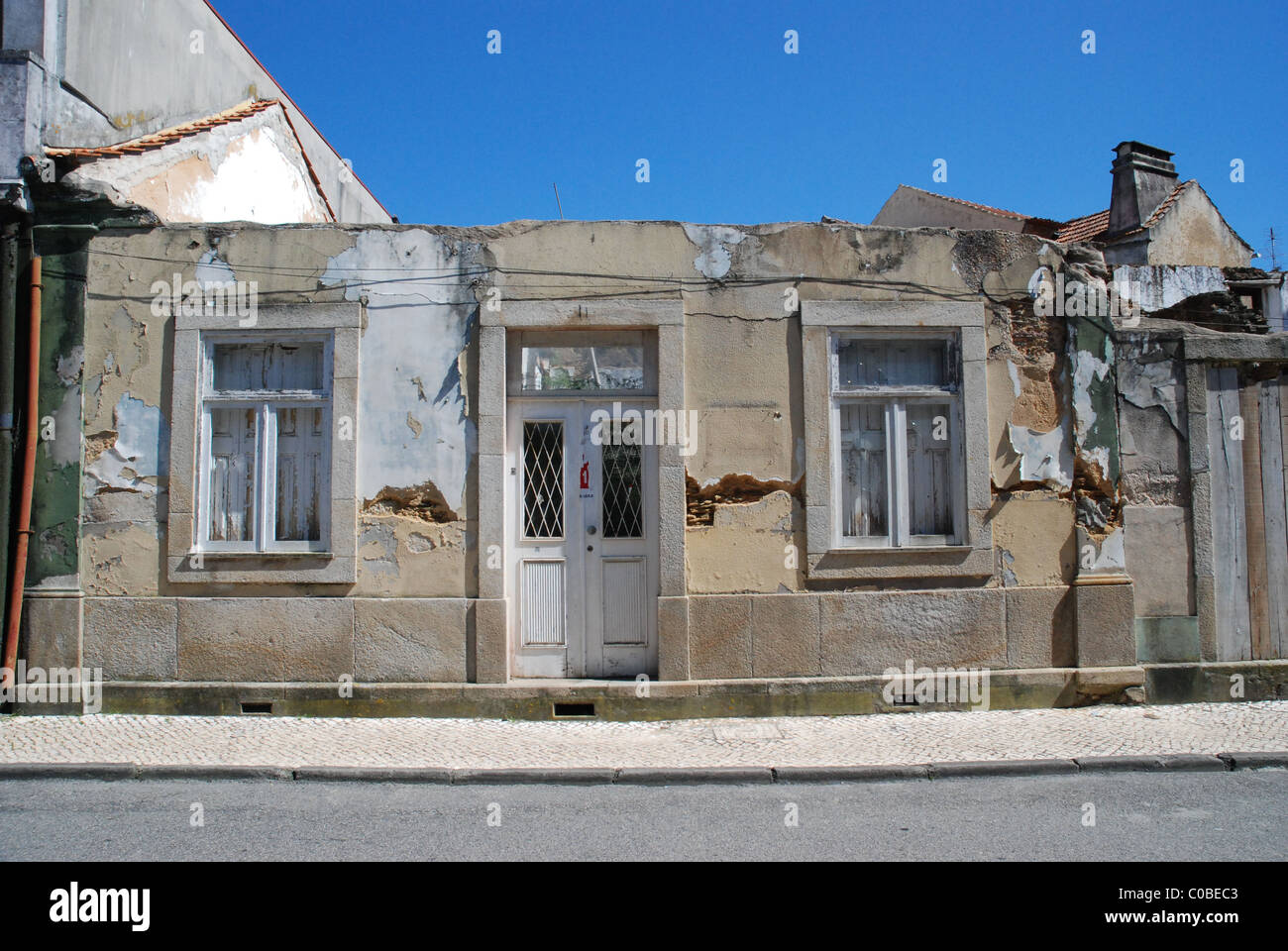 Old house facade with no roof on a blue sky background Stock Photo - Alamy