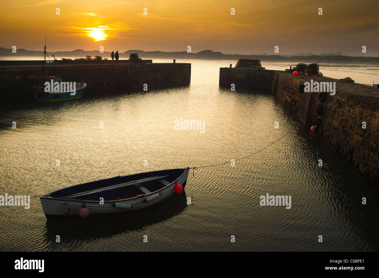 Beadnell harbour at sunset Stock Photo - Alamy