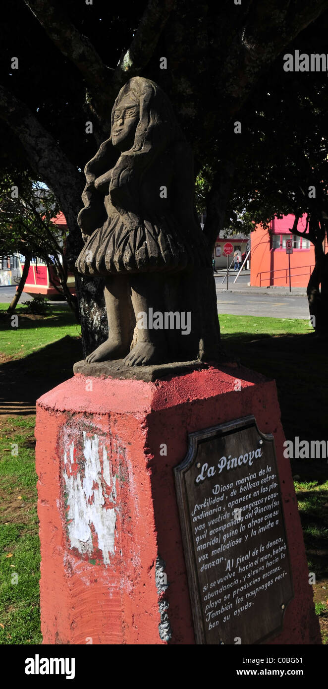 Brown effigy on red plinth with information plaque of La Pincoya sea ...