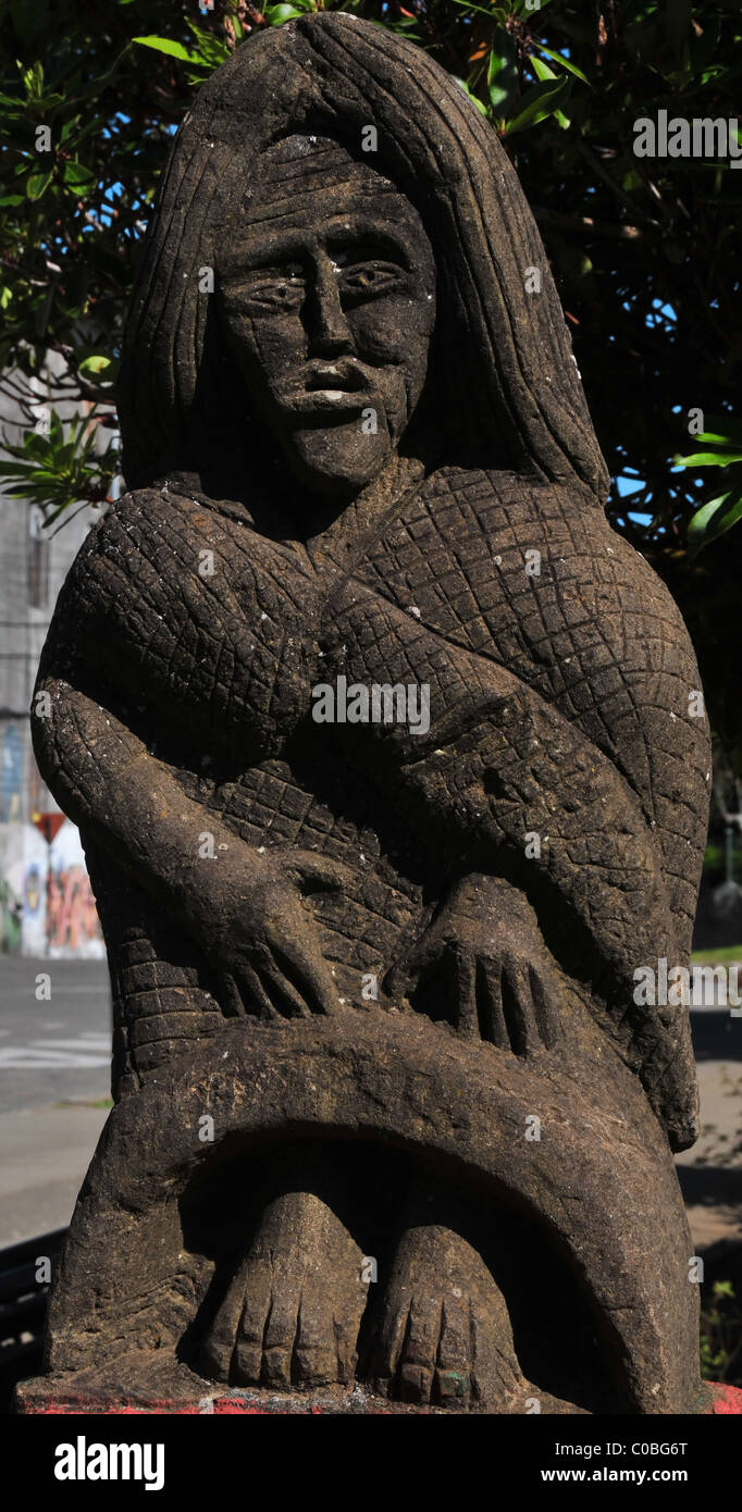 Close-up view of brown effigy of La Fiura mythical monster, plinth ...