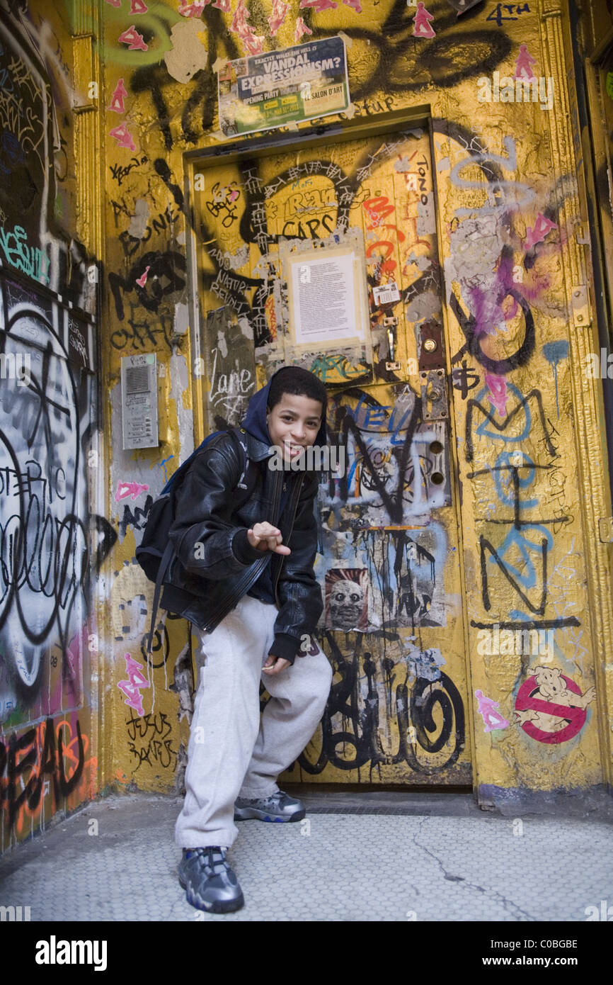 Preteen mugging for the camera in front of the entry way to a Lower ...