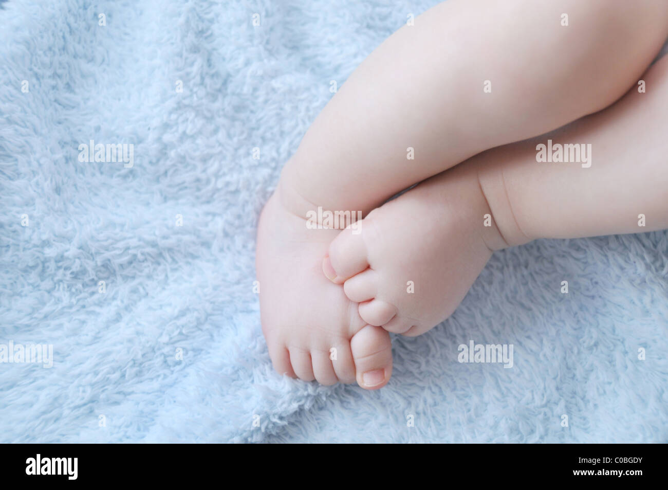 Curled up feet hi-res stock photography and images - Alamy