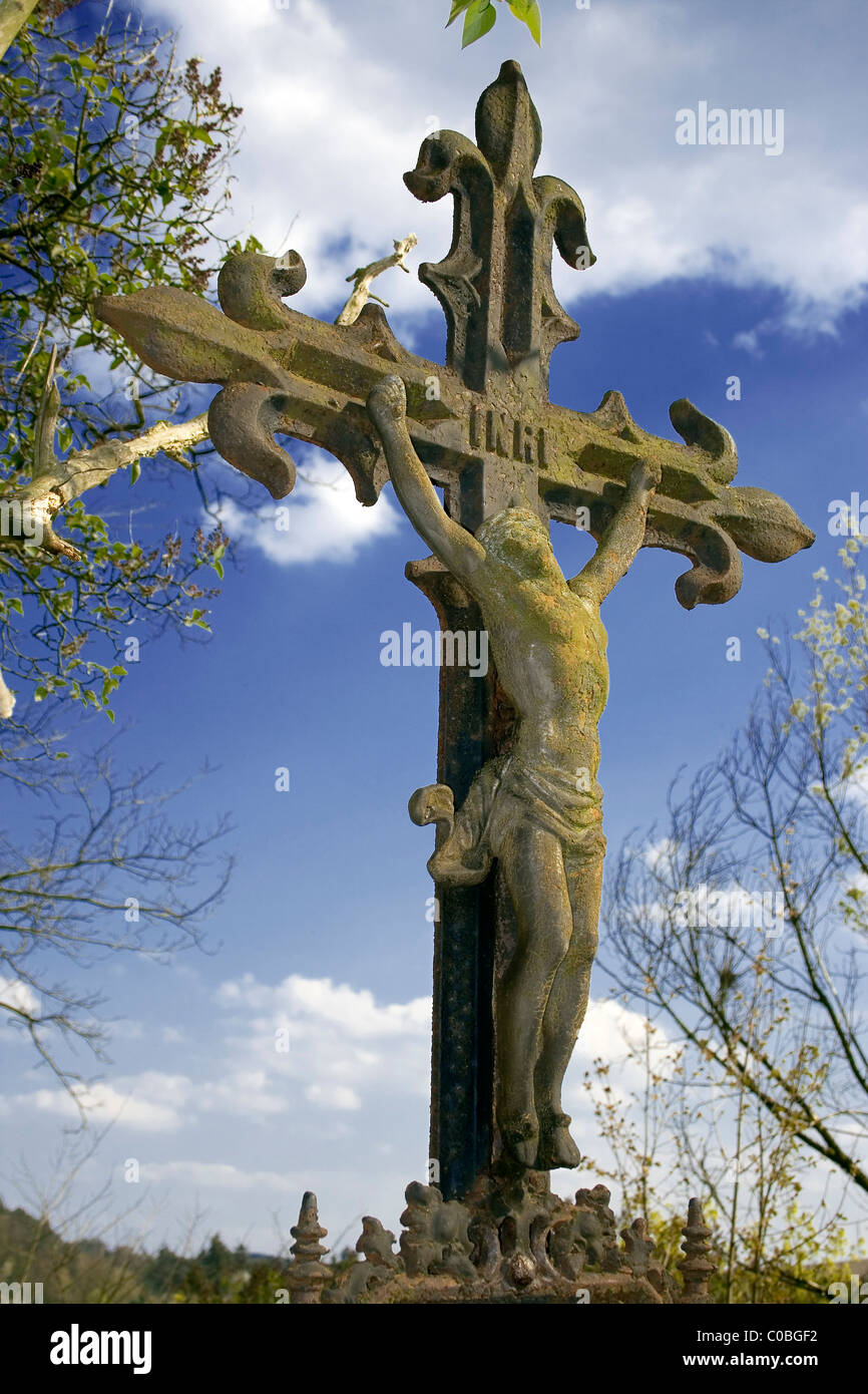 vintage iron crucifix against blue sky Stock Photo - Alamy
