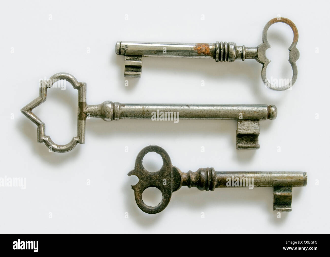 three vintage keys isolated at white Stock Photo - Alamy