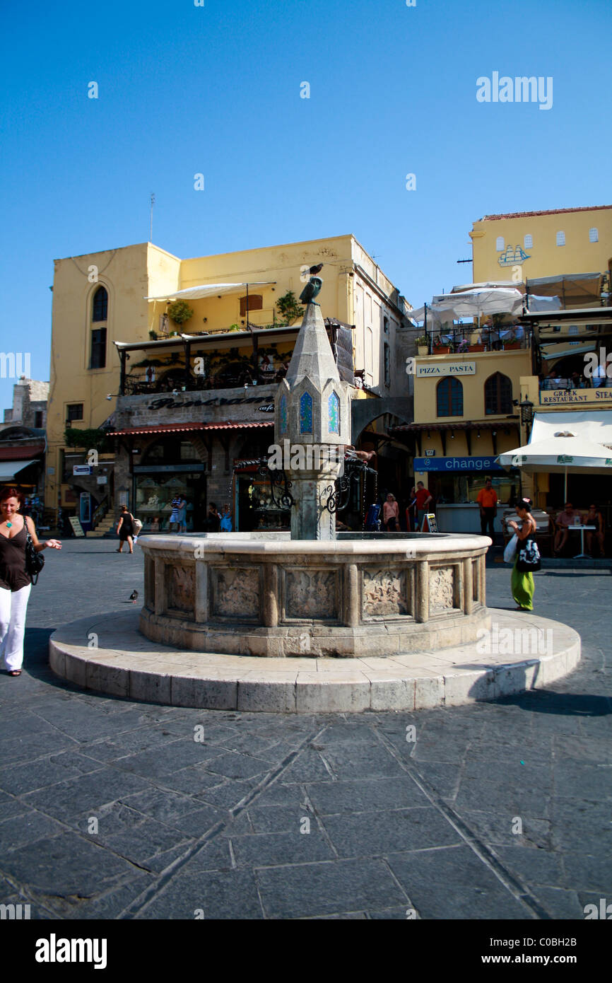 Pigeons enjoying the fountain in Hippocrates' Square, Rhodes Stock ...