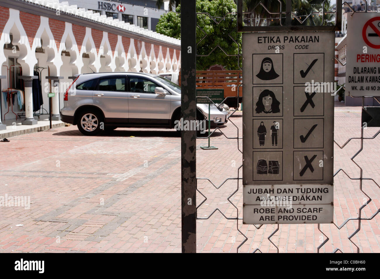 Dress code before entering Jamek Mosque in Kuala Lumpur, Malaysia Stock ...