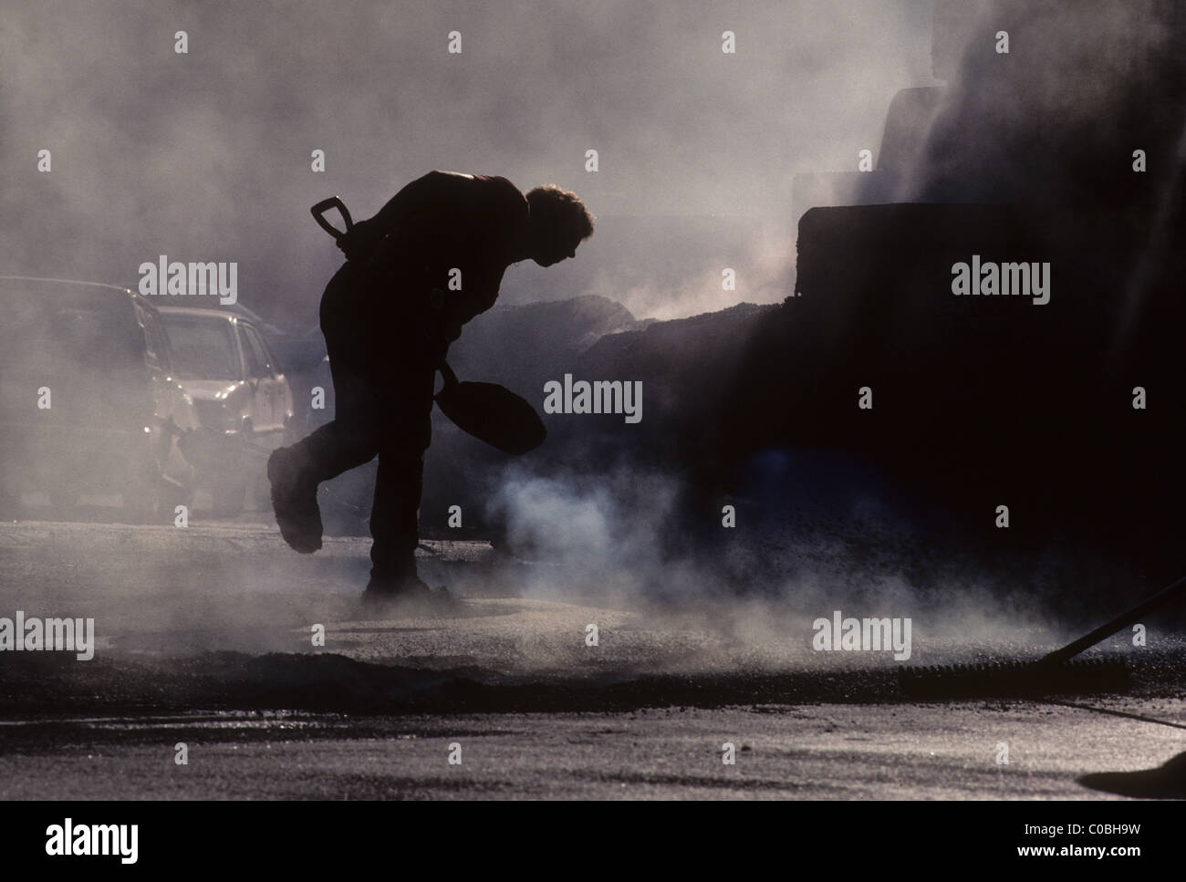 Laborers working on road construction Stock Photo - Alamy