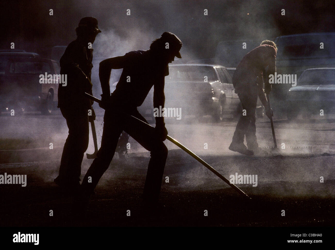 Laborers working on road construction Stock Photo - Alamy
