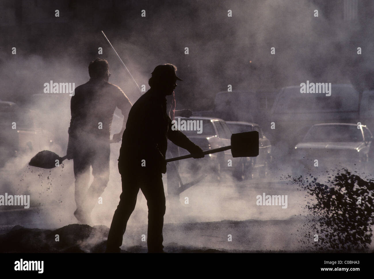 Laborers working on road construction Stock Photo - Alamy