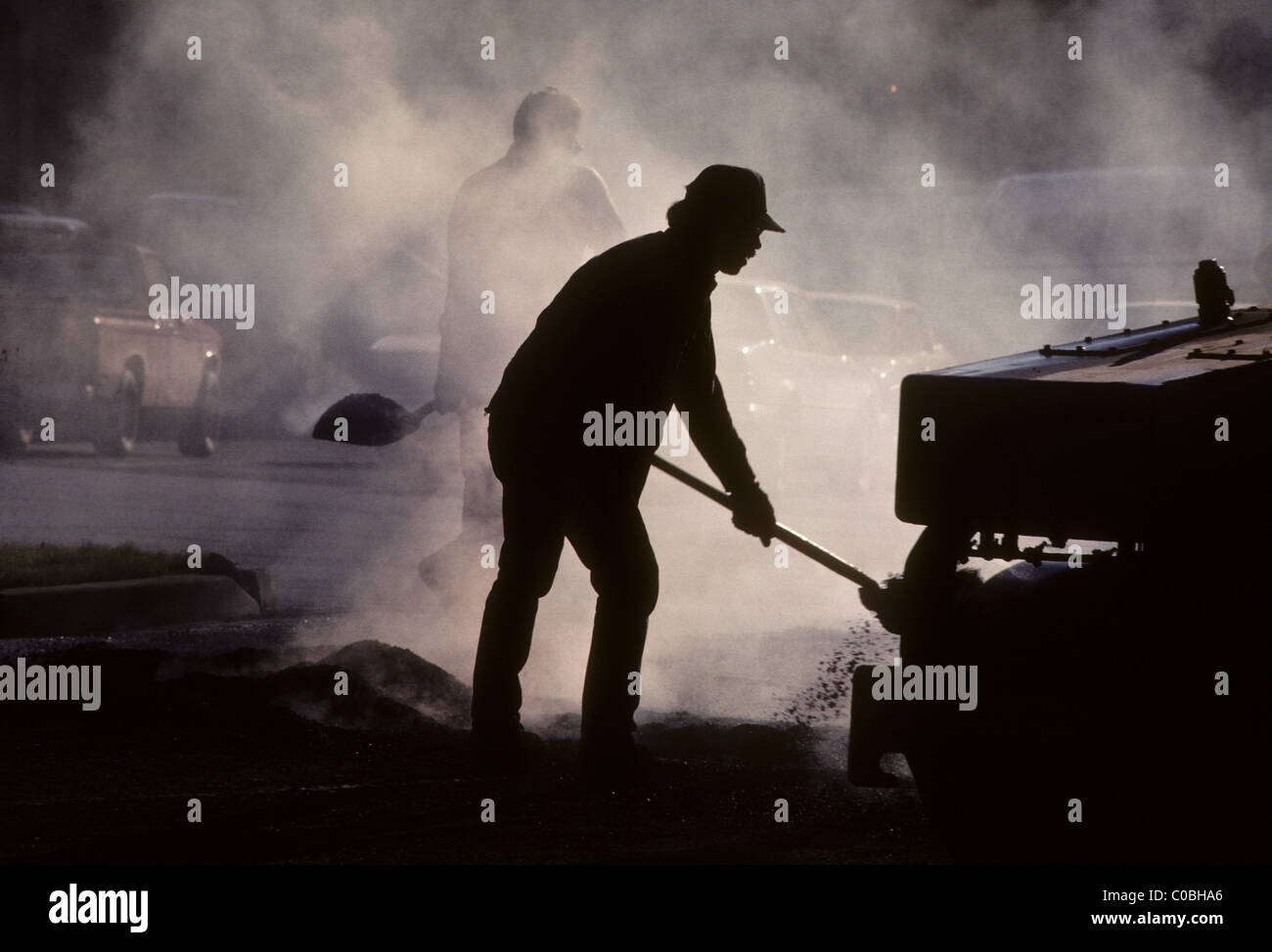 Laborers working on road construction Stock Photo - Alamy