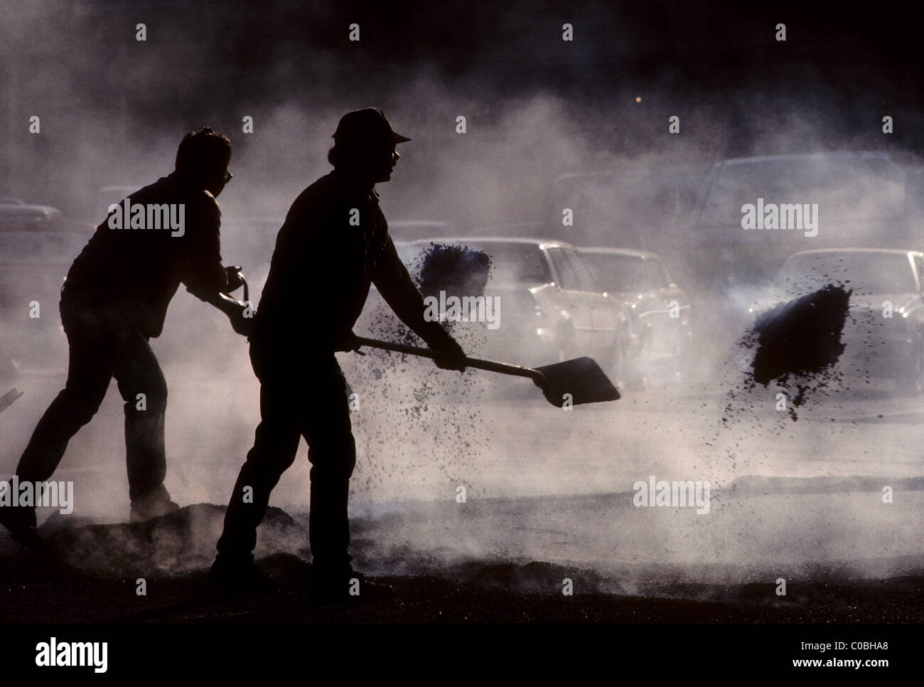 Laborers working on road construction Stock Photo - Alamy