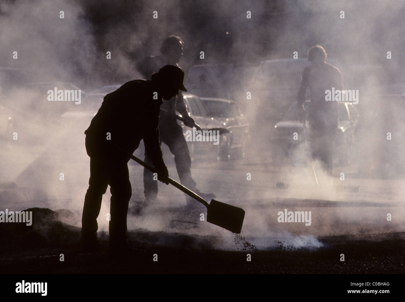 Laborers working on road construction Stock Photo - Alamy