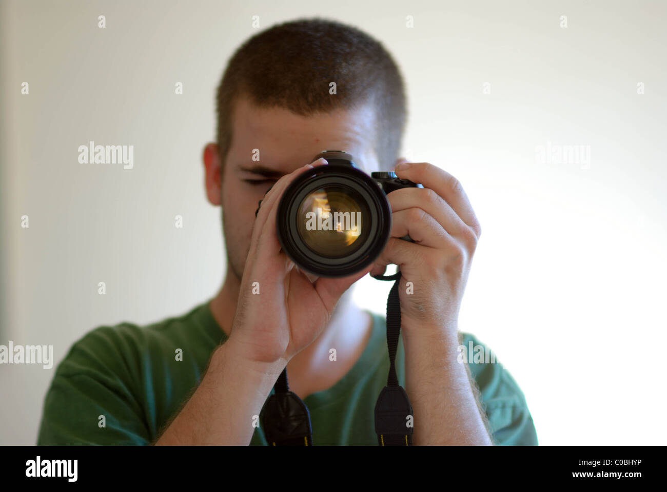 Photographer focusing camera Stock Photo - Alamy