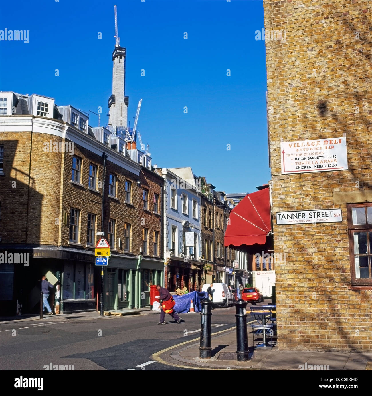 The Shard building under construction rising above a street level view ...