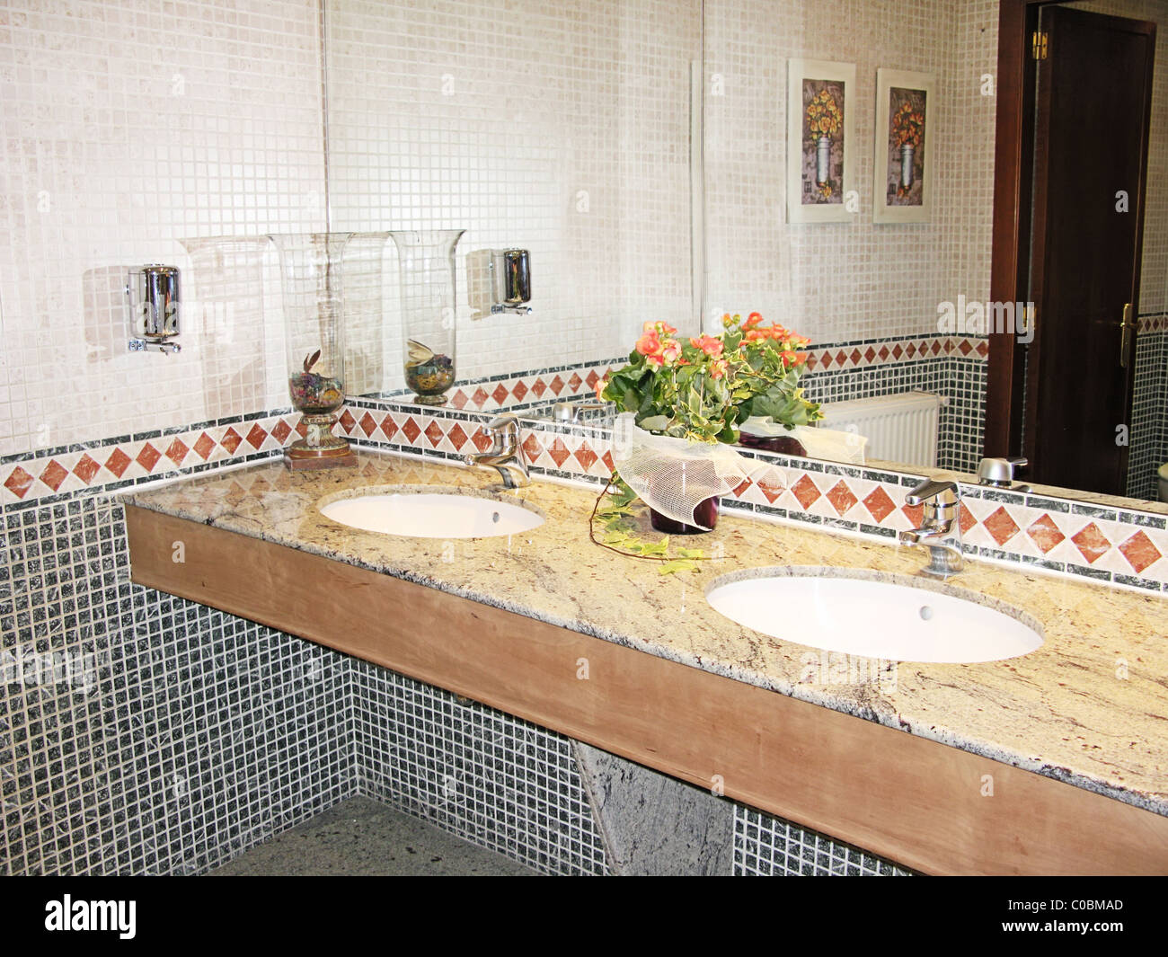 Empty and clean bathroom with mirror, tap and sink Stock Photo - Alamy