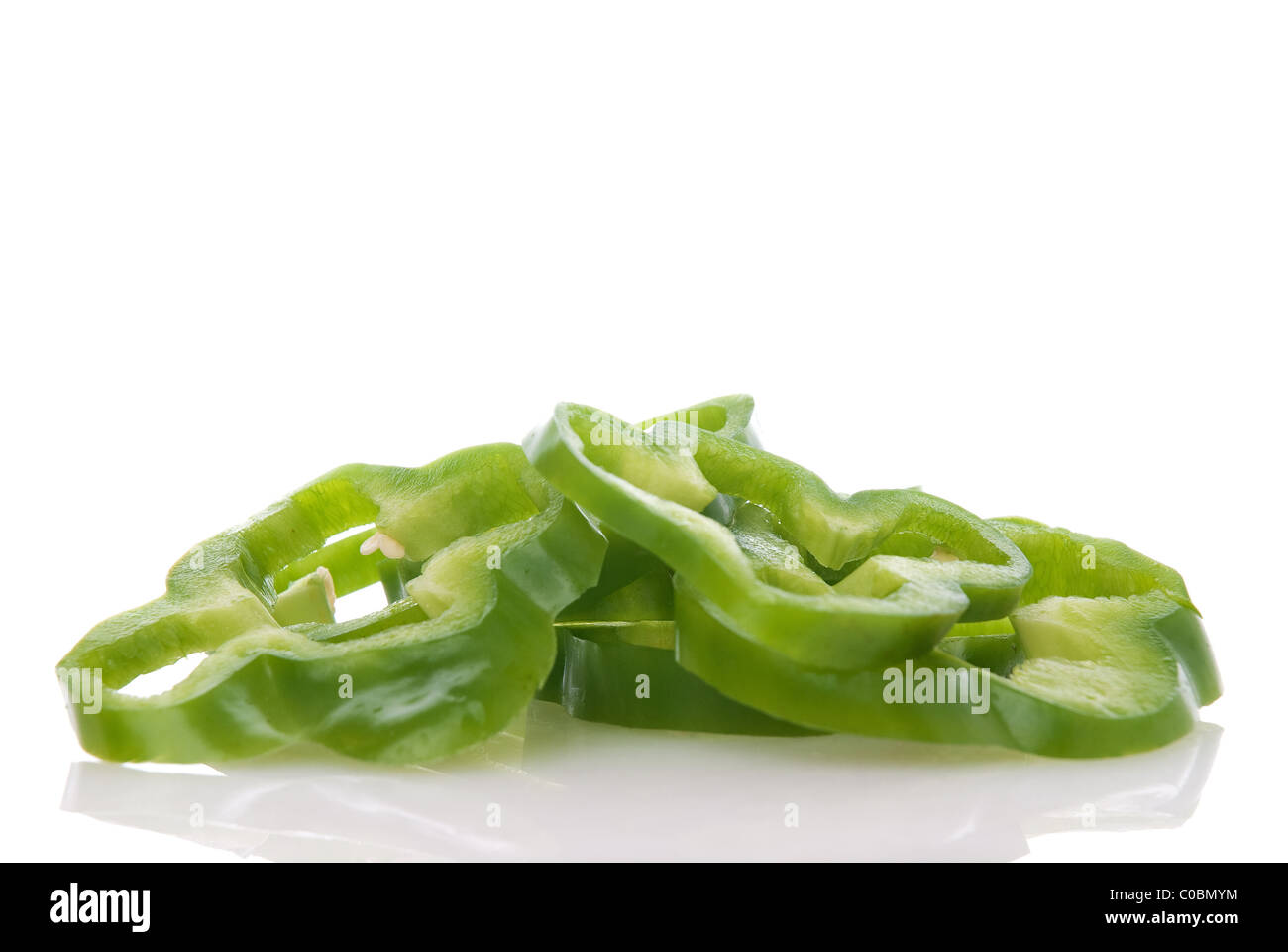 Sliced green pepper isolated on white background Stock Photo - Alamy