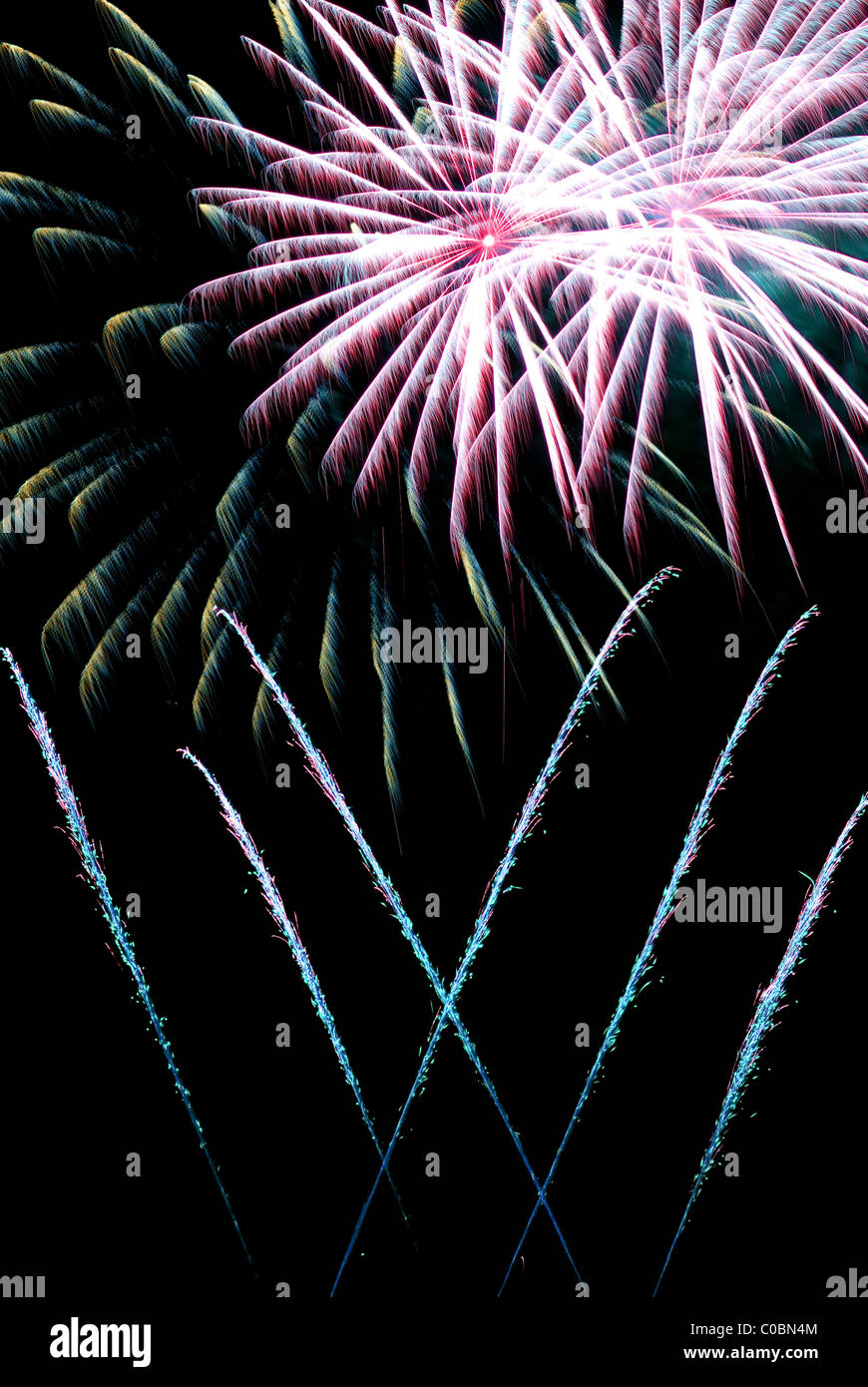 Colorful fireworks in the night dark sky Stock Photo - Alamy