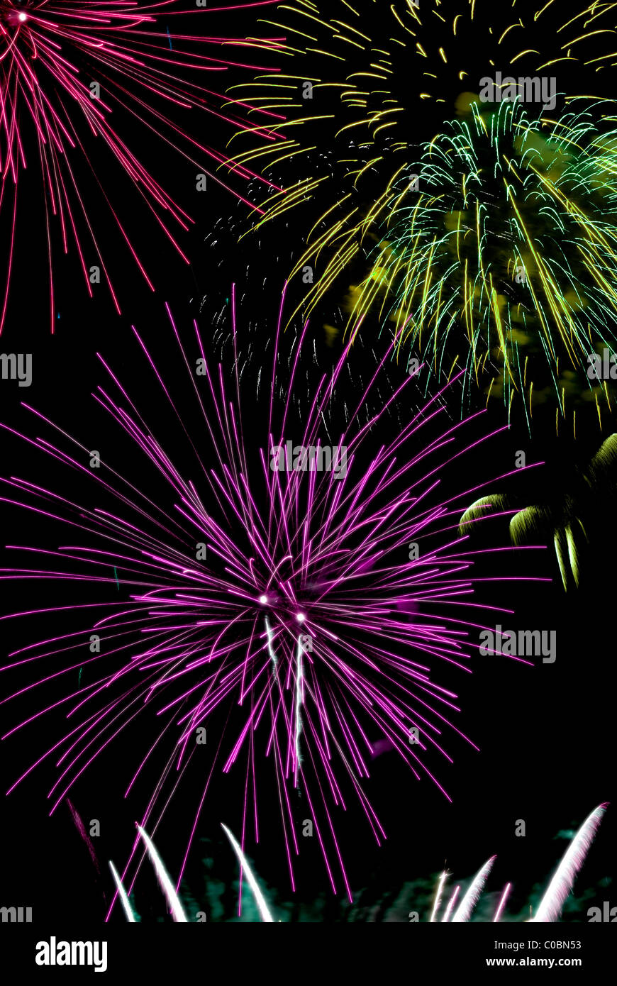 Colorful fireworks in the night dark sky Stock Photo - Alamy
