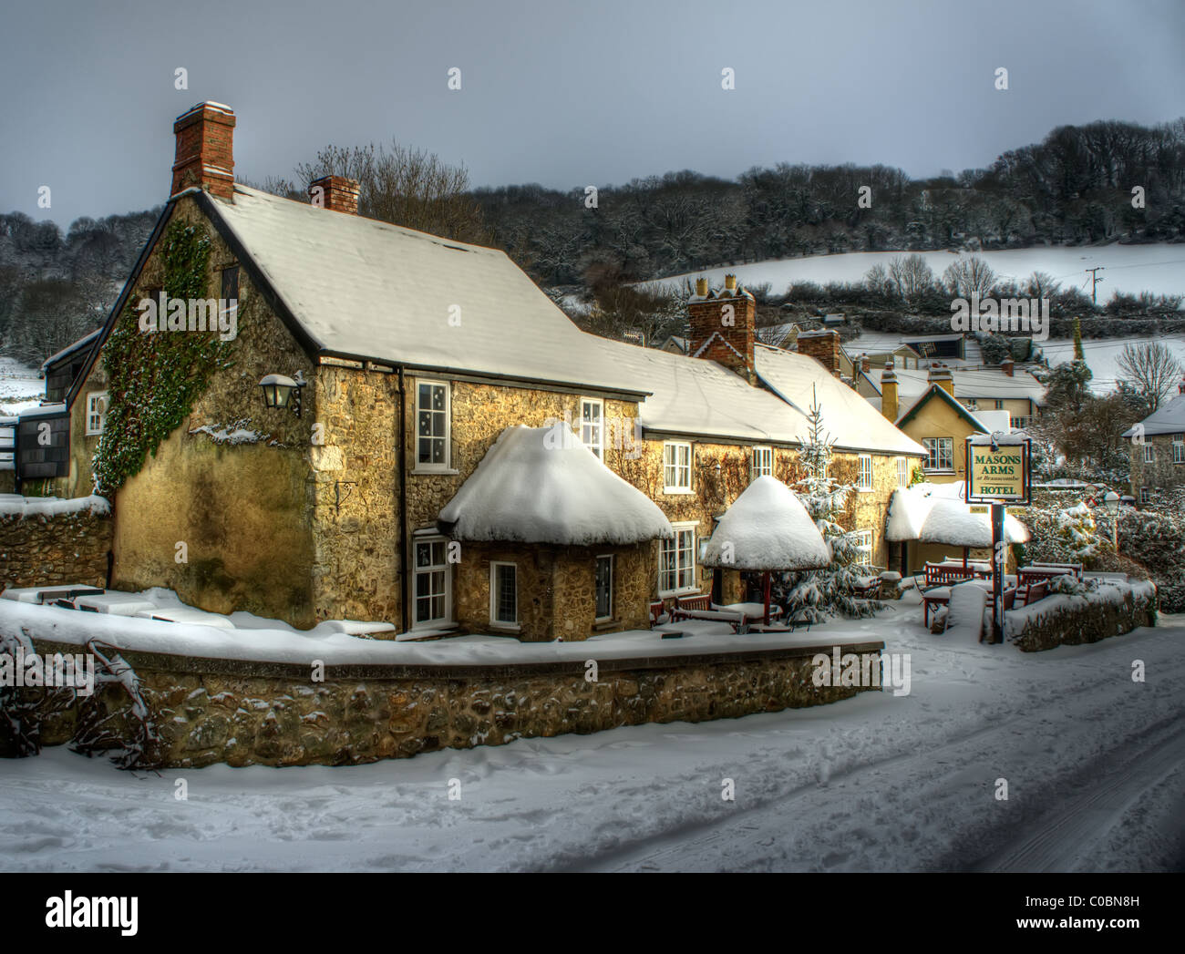 Masons Arms Branscombe Devon winter pub snow cold Stock Photo - Alamy