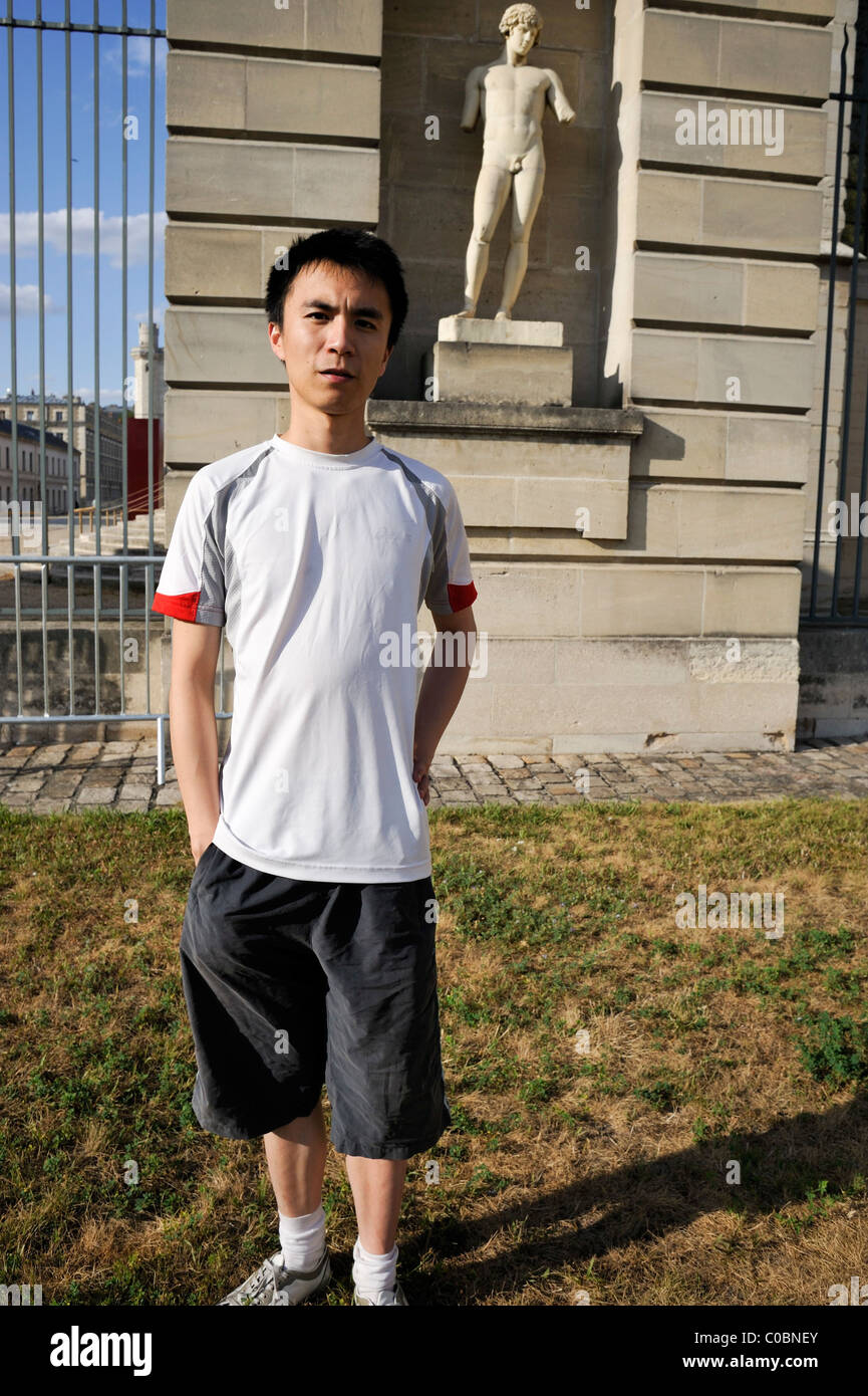 Paris, France, Portrait Young Chinese Man, Standing, Outside, alone ...
