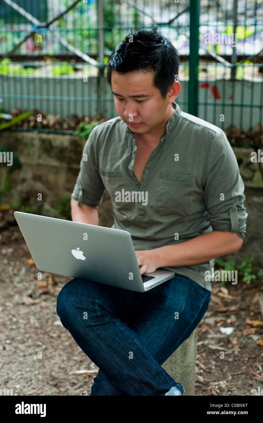 Paris, France, Portrait Young Chinese Man, Looking at Laptop Computer ...