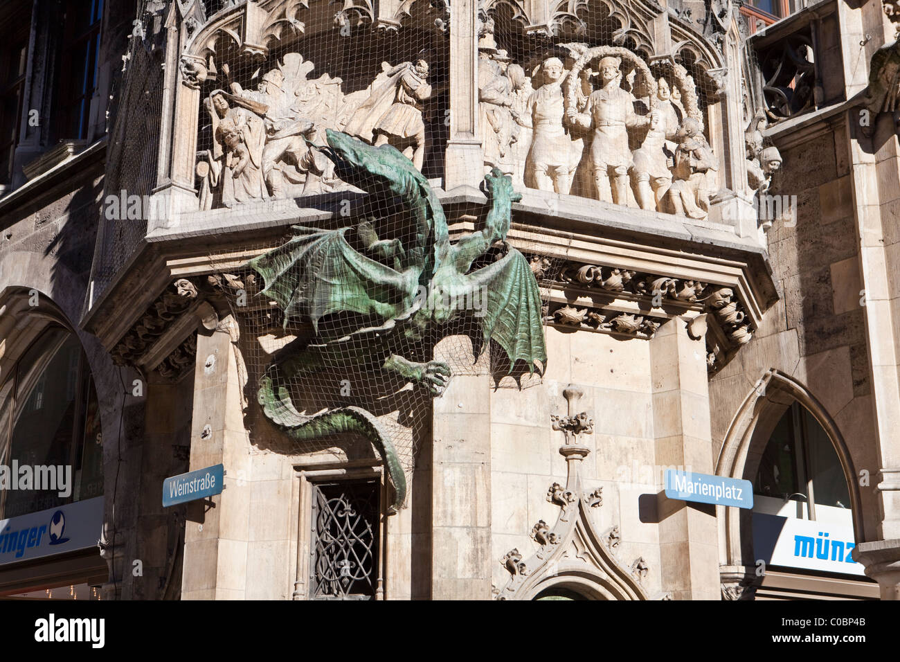 Architectural detail of dragon and human representation on the Munich ...
