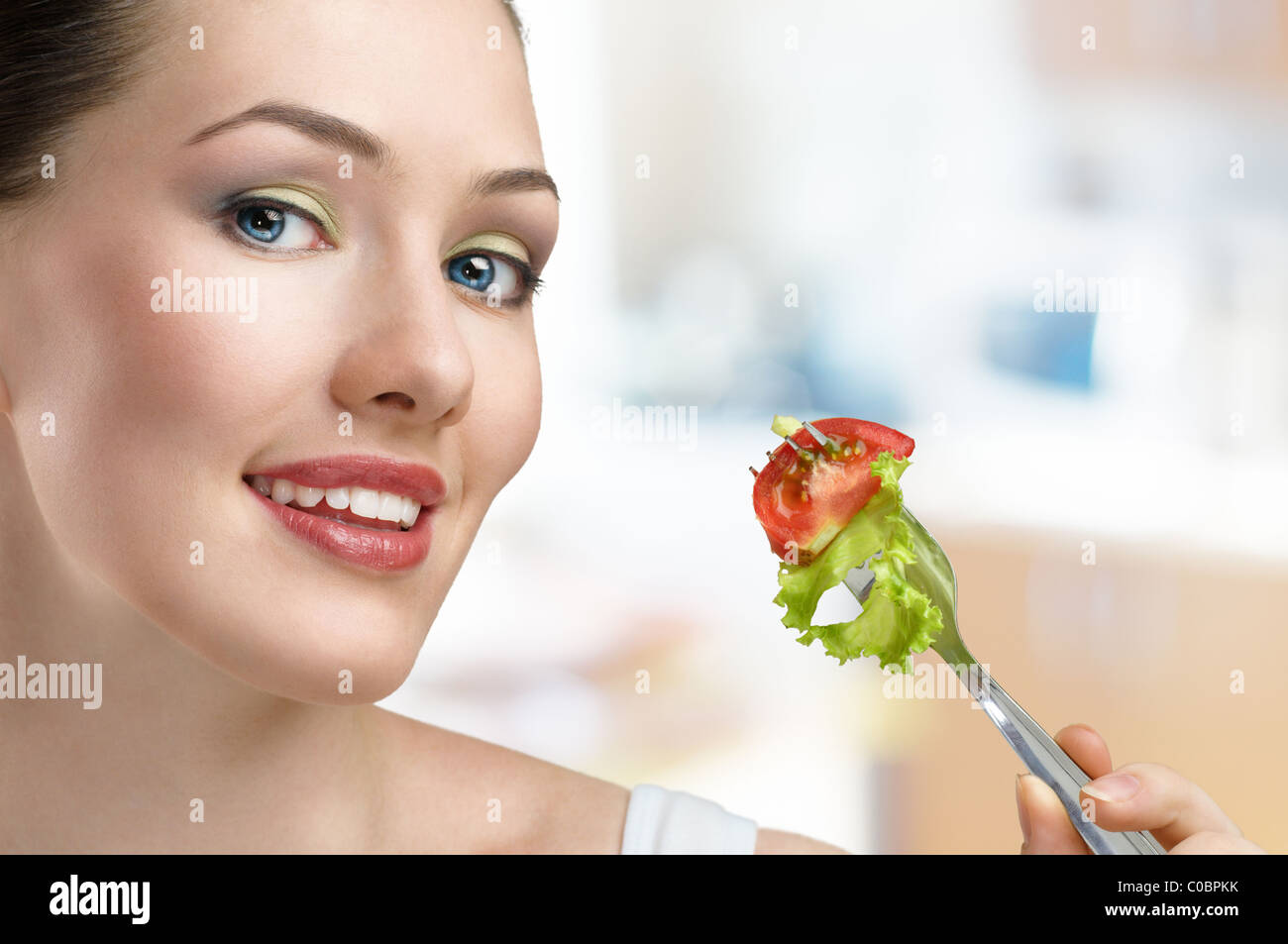 A beautiful slender girl eating healthy food Stock Photo - Alamy