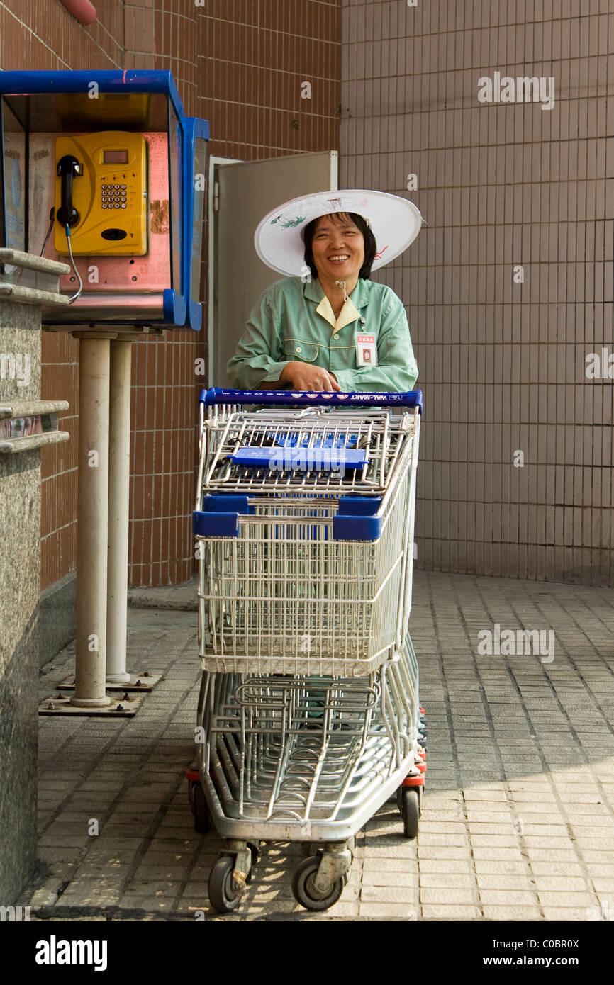 Chinese women with trolleys outside Wall Mart in Dongguan Stock Photo ...