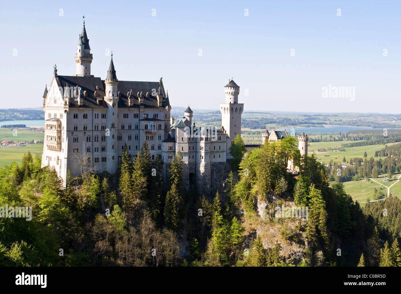 Neu Schwanstein Castle surrounded with lush foliage Stock Photo - Alamy