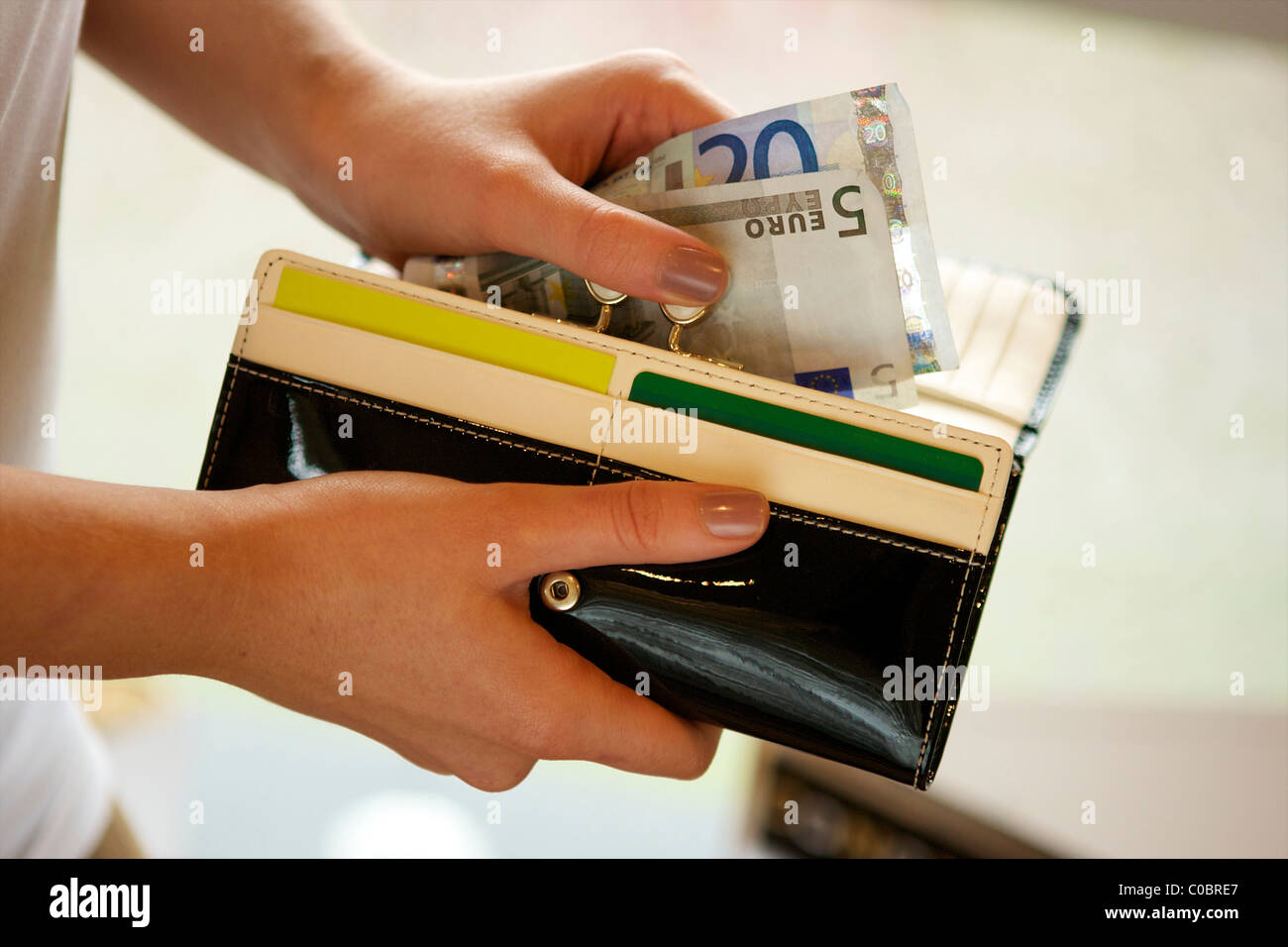female holding purse Stock Photo - Alamy