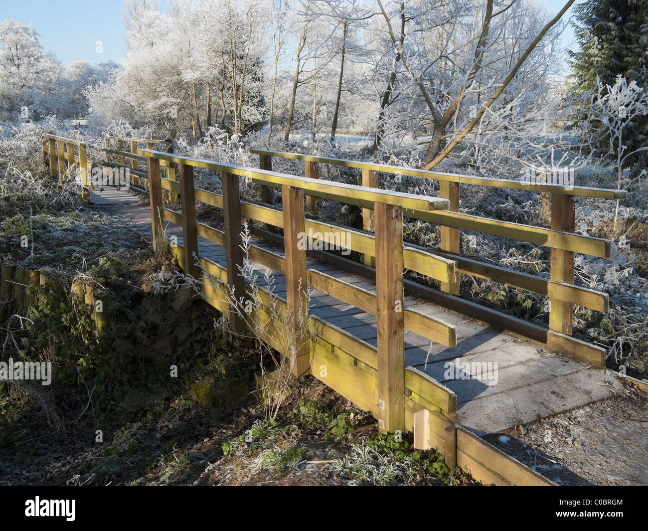 footpath through a snow covered winter landscape Stock Photo - Alamy