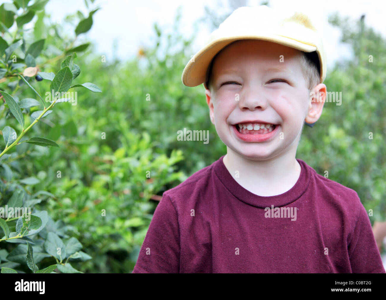 Young boy with a big cheesey smile Stock Photo - Alamy