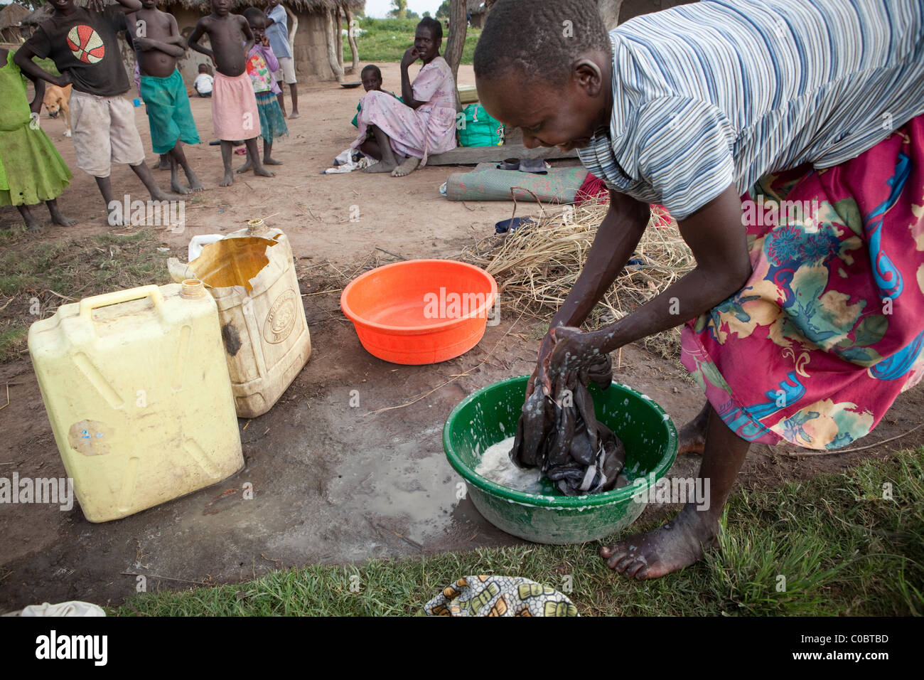 A woman washes clothes in rural Amuria District, Uganda, East Africa ...