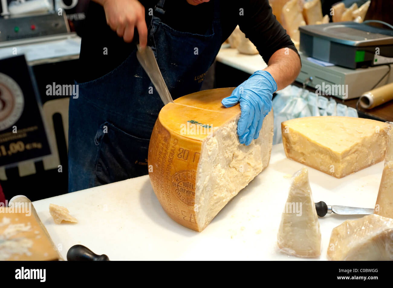 Man cutting parmesan cheese hi-res stock photography and images - Alamy