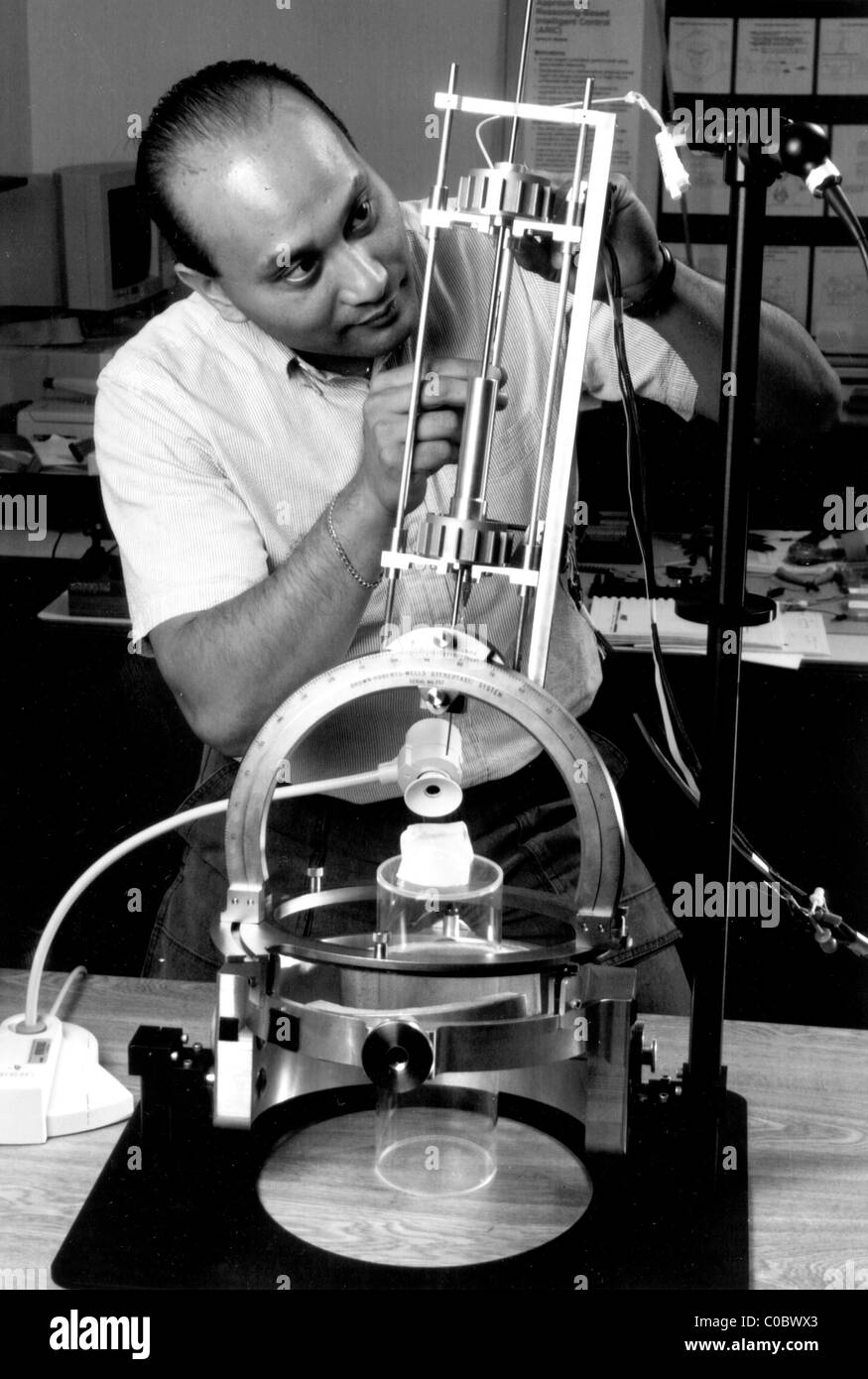 Mechanical Engineer Michael Guerrero works on the Robot Brain Surgeon ...