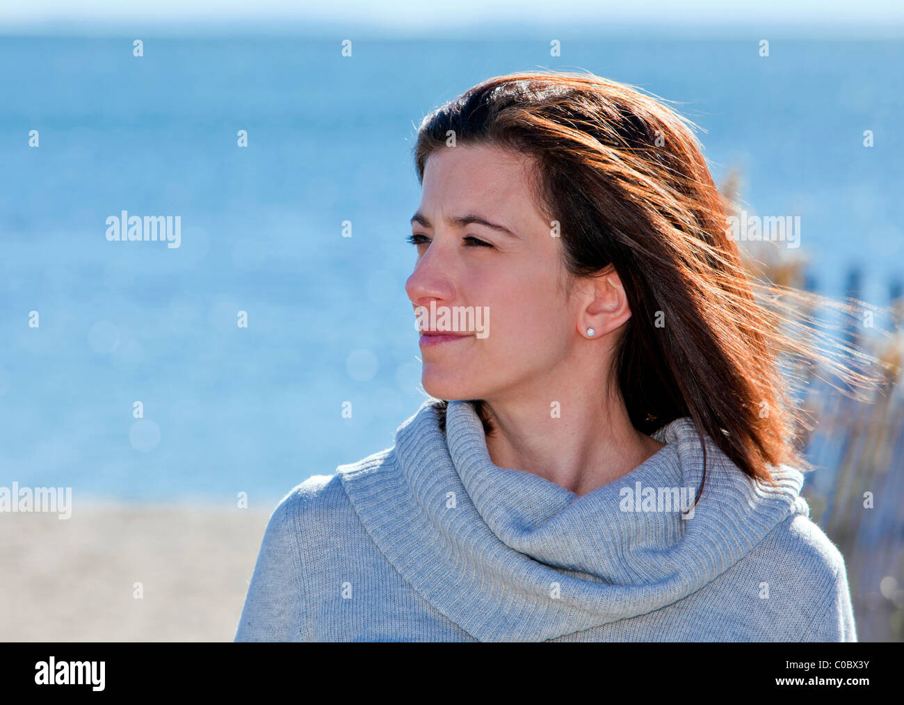 Pretty woman with confident smile portrait at the beach Stock Photo - Alamy